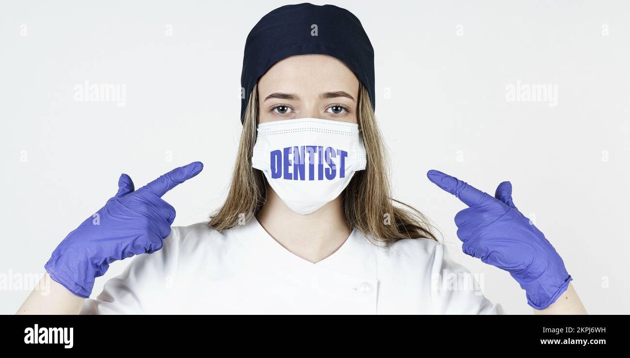 Medicine concept. The doctor points his fingers at the mask with the ...