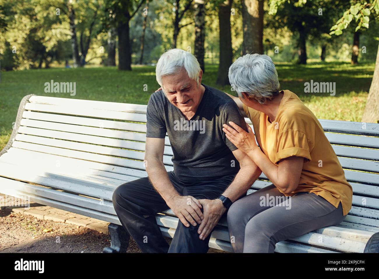 During morning sportive stroll or making exercises in a park, elderly ...