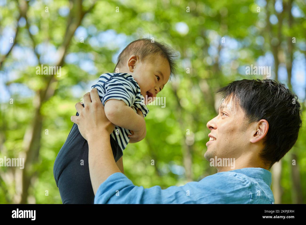 Japanese father holding baby Stock Photo - Alamy