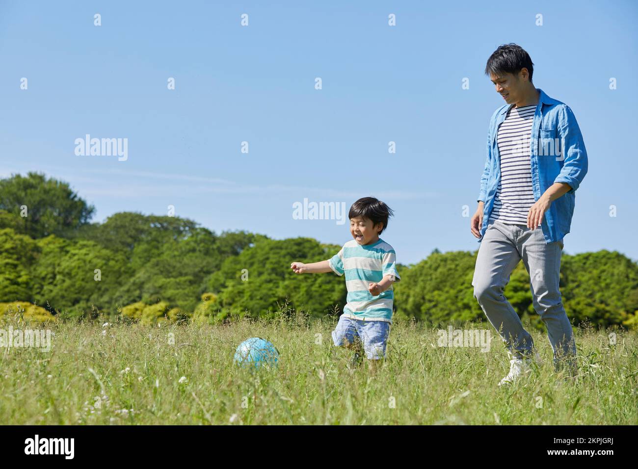 Japanese parent and child playing with a ball Stock Photo - Alamy