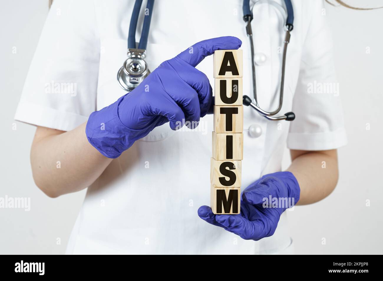 Medicine and health concept. The doctor holds cubes in his hands on ...