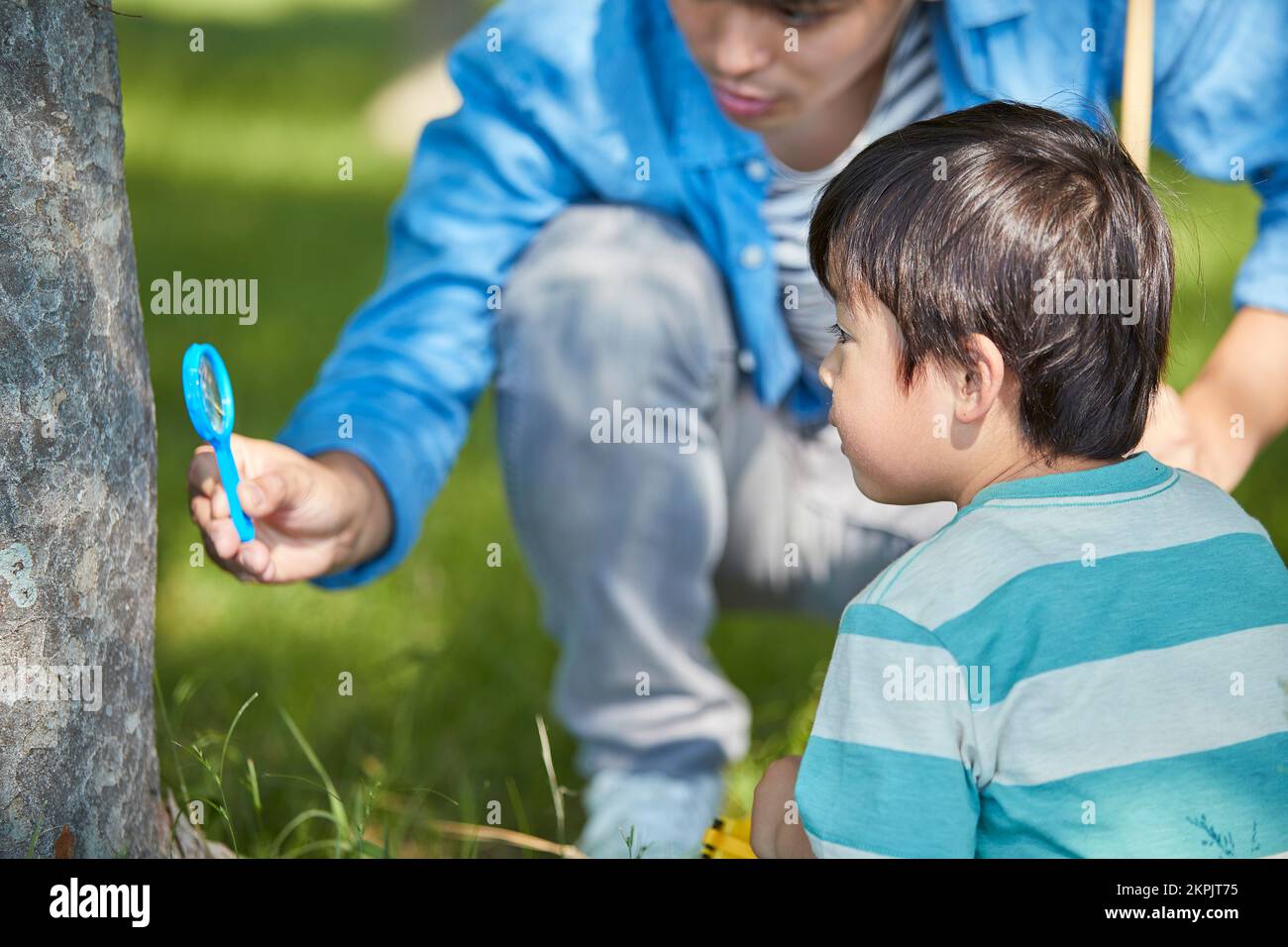 Japanese parent and child collecting insects Stock Photo - Alamy