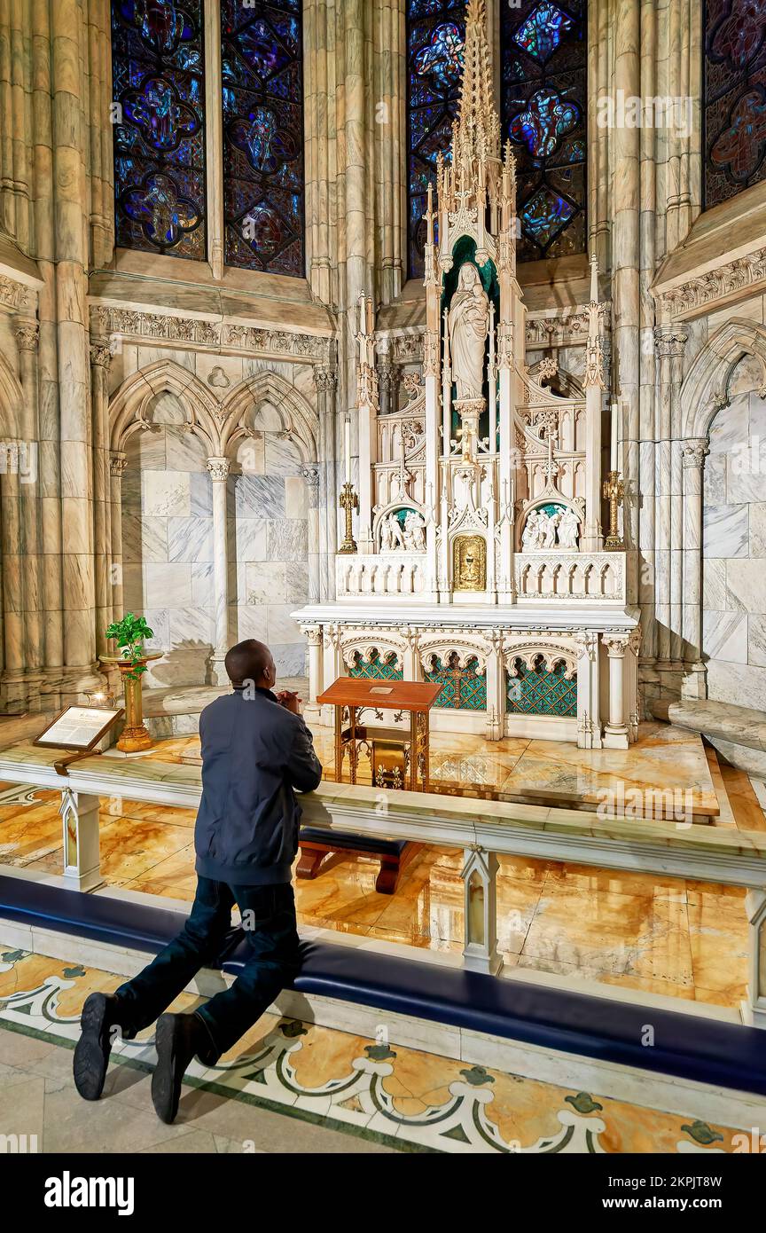 New York. Manhattan. United States. St. Patrick's cathedral. A faithful ...