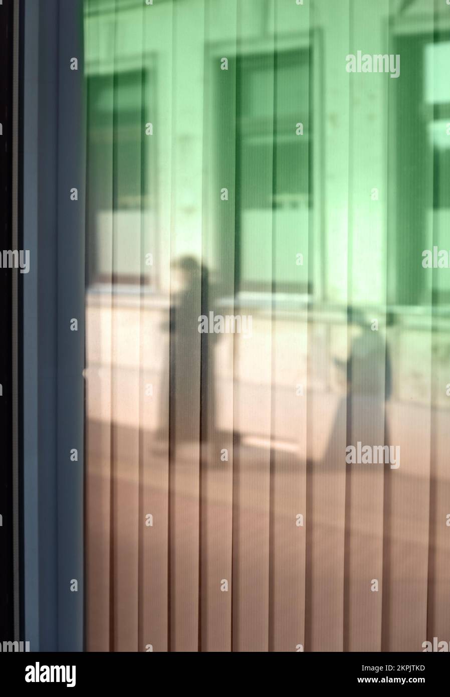 Street view with a woman reflected in the window Stock Photo - Alamy