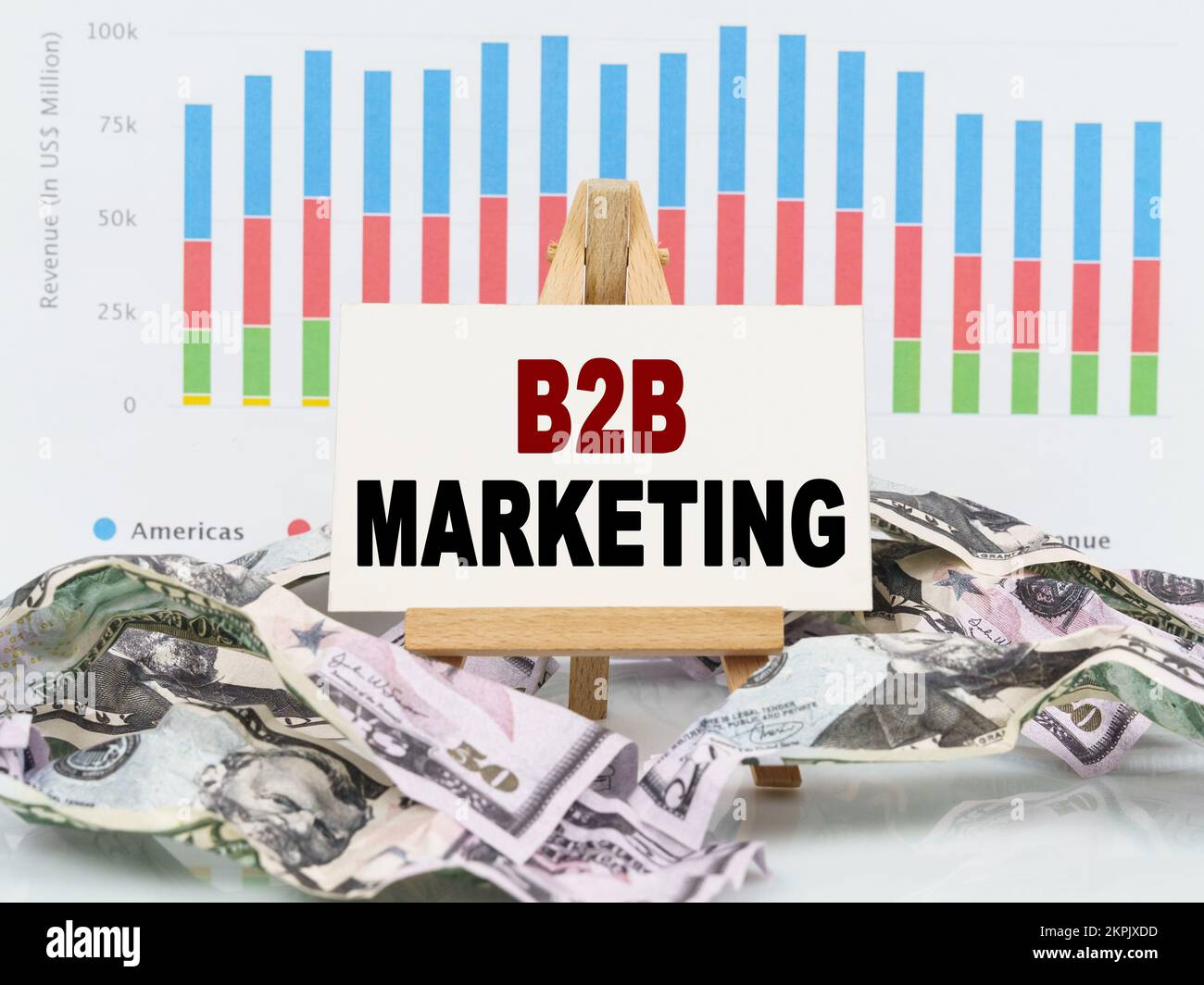 Business and finance concept. Among financial charts and money is a ...