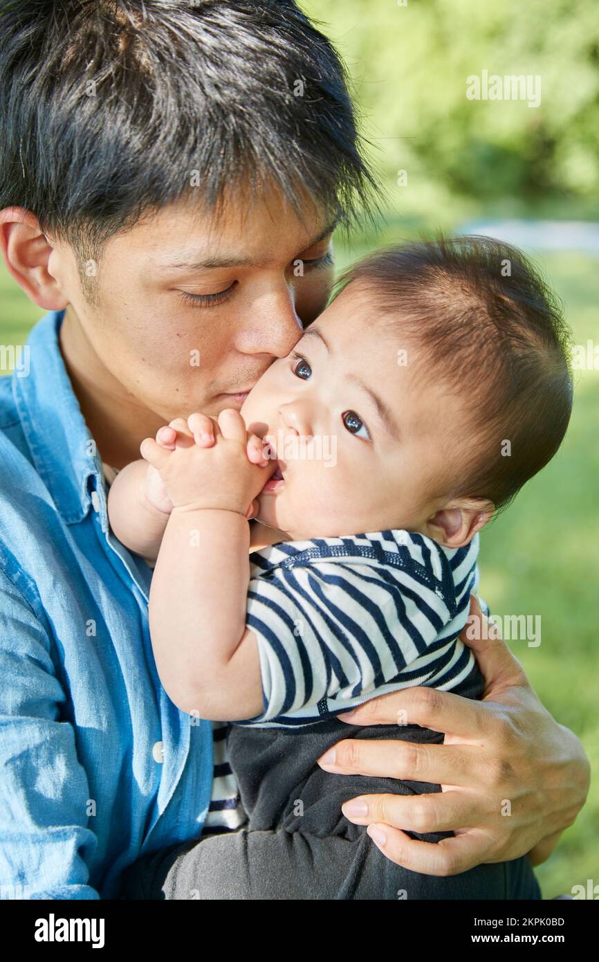 Japanese father hugging baby Stock Photo - Alamy