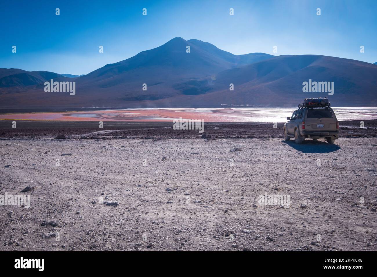 Jeep parked overlooking Laguna Colorada (Red Lagoon) in Eduardo Avaroa ...