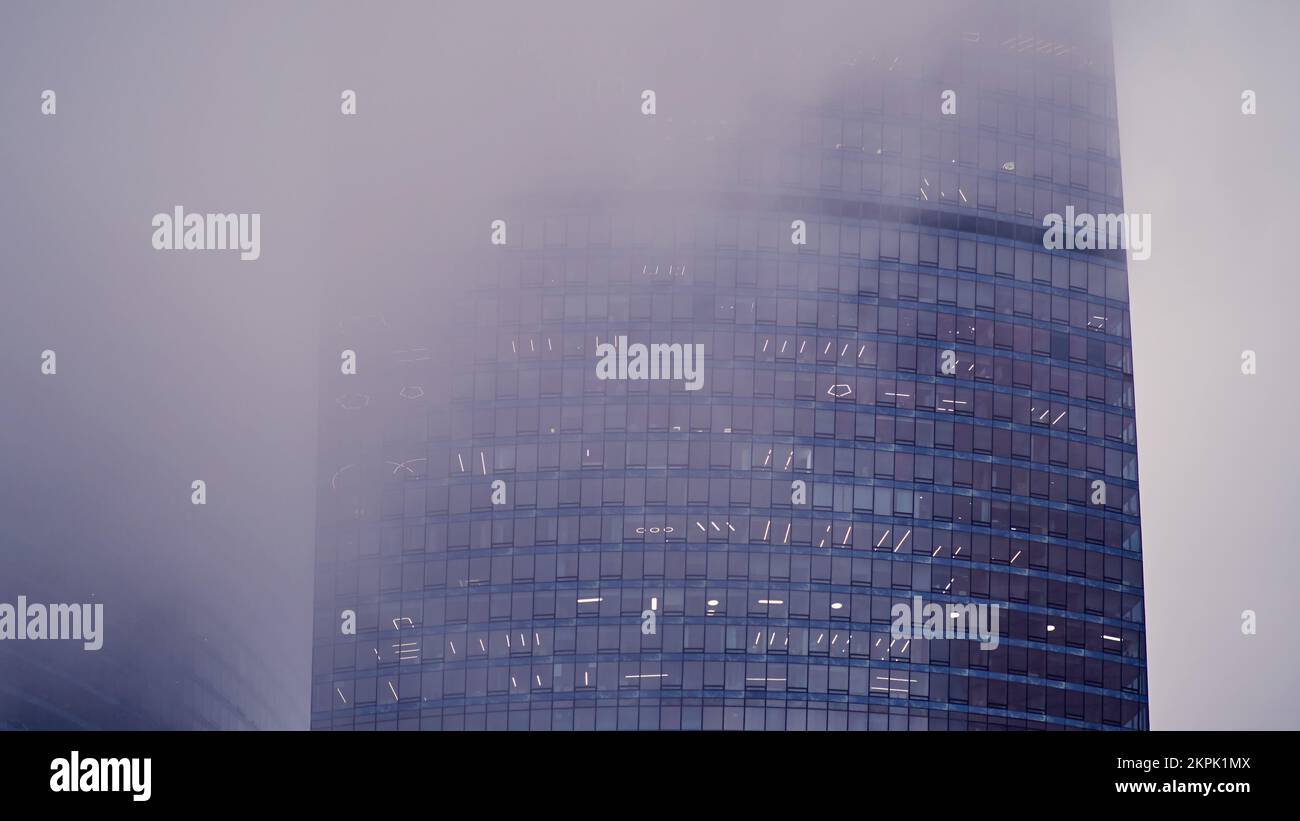 Windows of skyscrapers in the fog, background copy space. Metal ...
