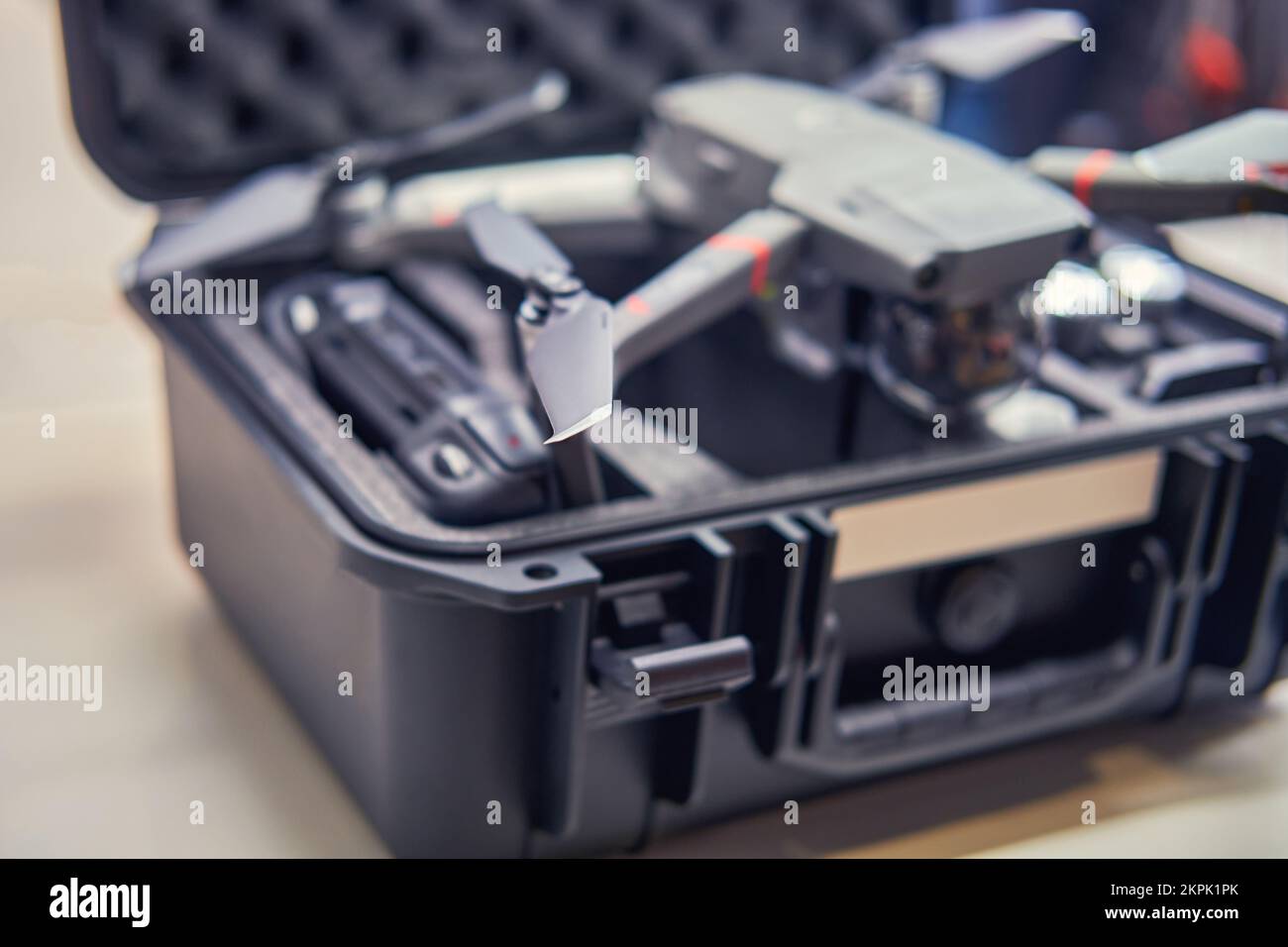 A drone with a camera in a box on a store shelf. Sale of drones in the ...