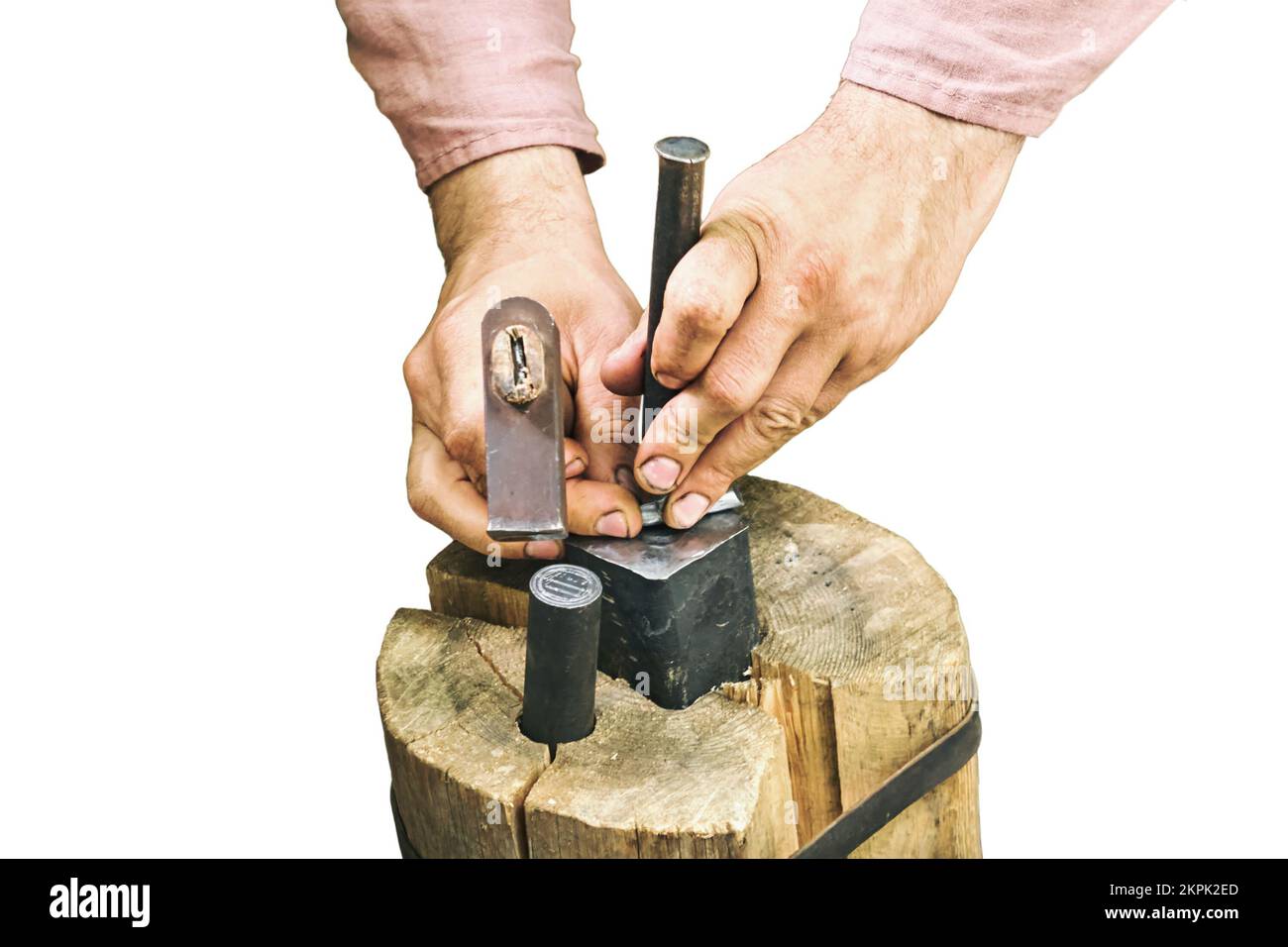 Production of medieval coins by casting and forging, isolated on a ...