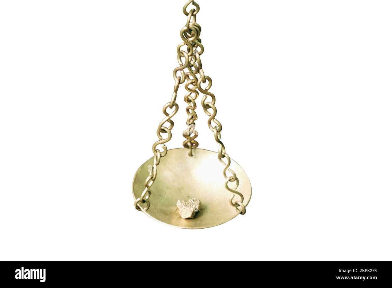 Golden scales for weighing coins, isolated on a white background ...