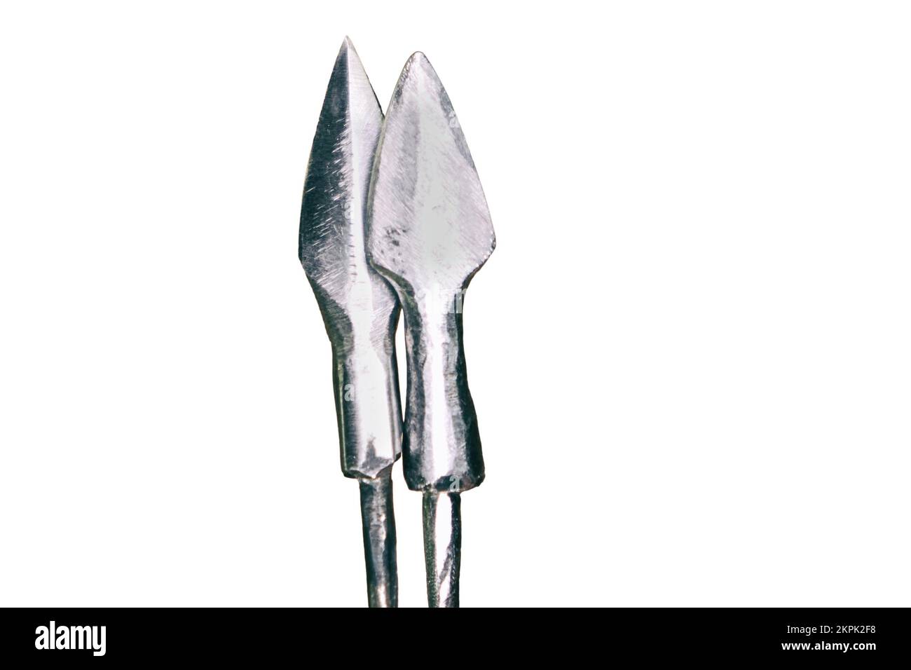 Making medieval arrows for bow shooting, isolated on a white background ...