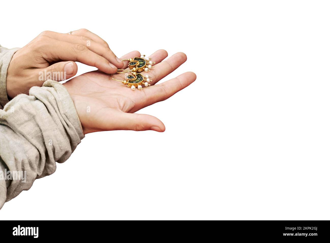 Making medieval jewelry - vintage earrings and rings, isolated on a ...