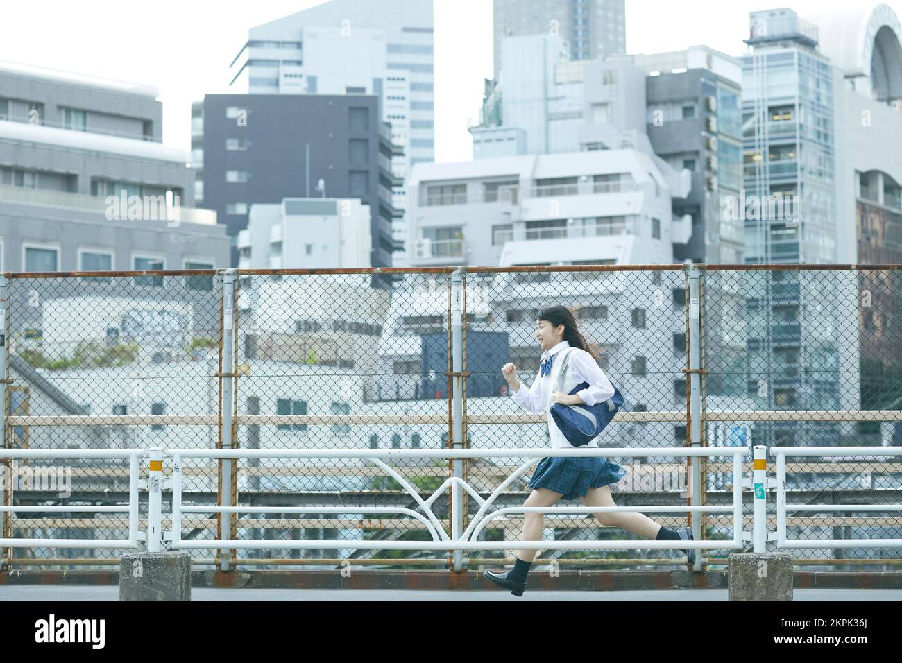 Japanese high school girl running Stock Photo - Alamy