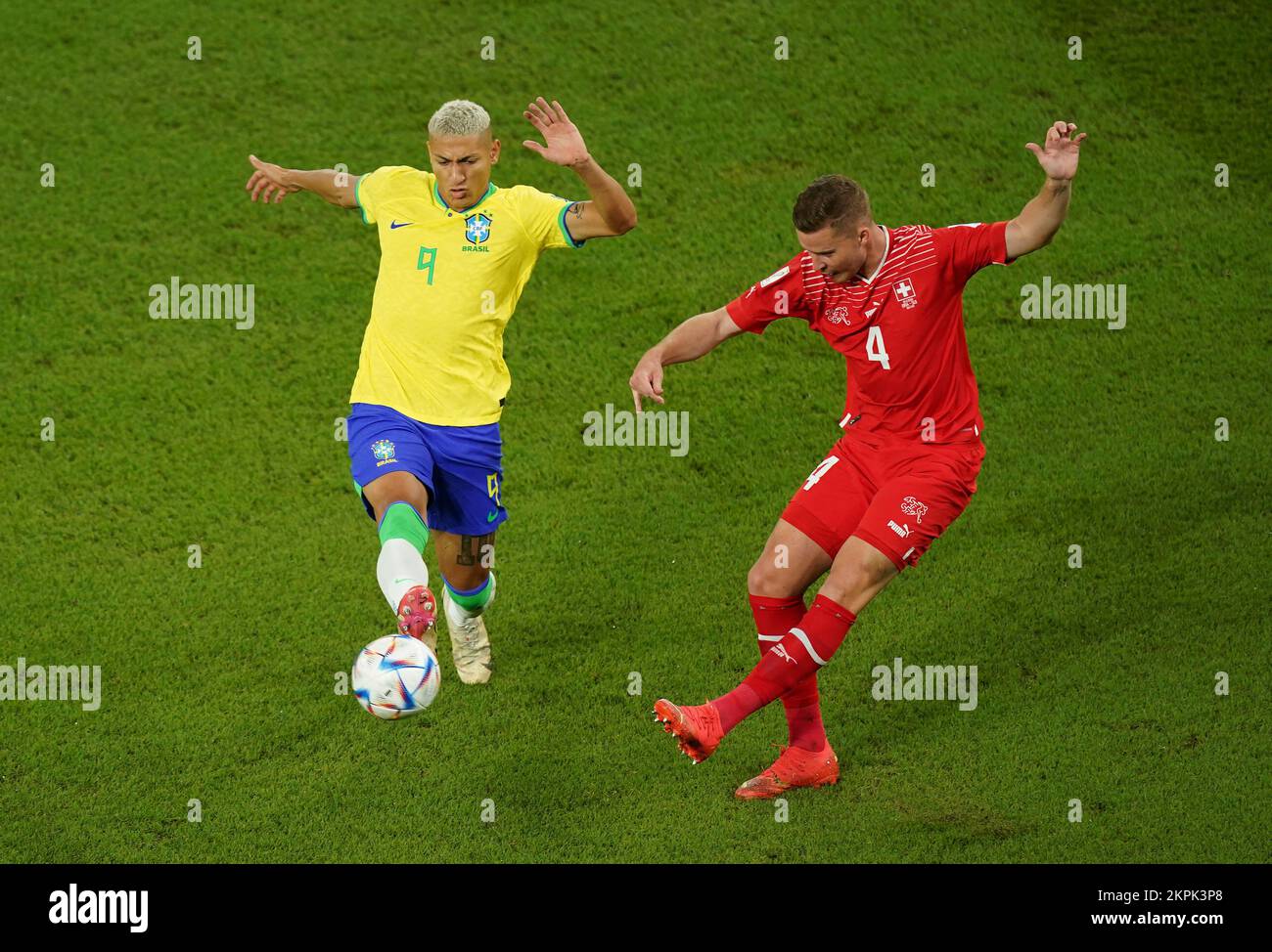 Brazil's Richarlison (left) and Switzerland's Nico Elvedi battle for ...