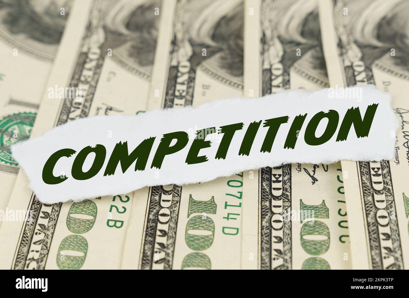 Business and finance concept. On the background of dollars lies a piece ...