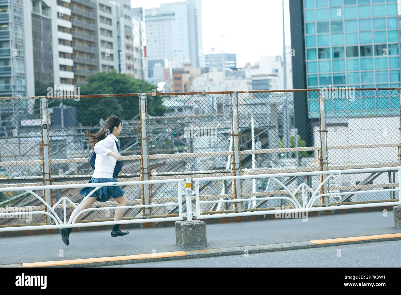 Japanese high school girl running Stock Photo - Alamy