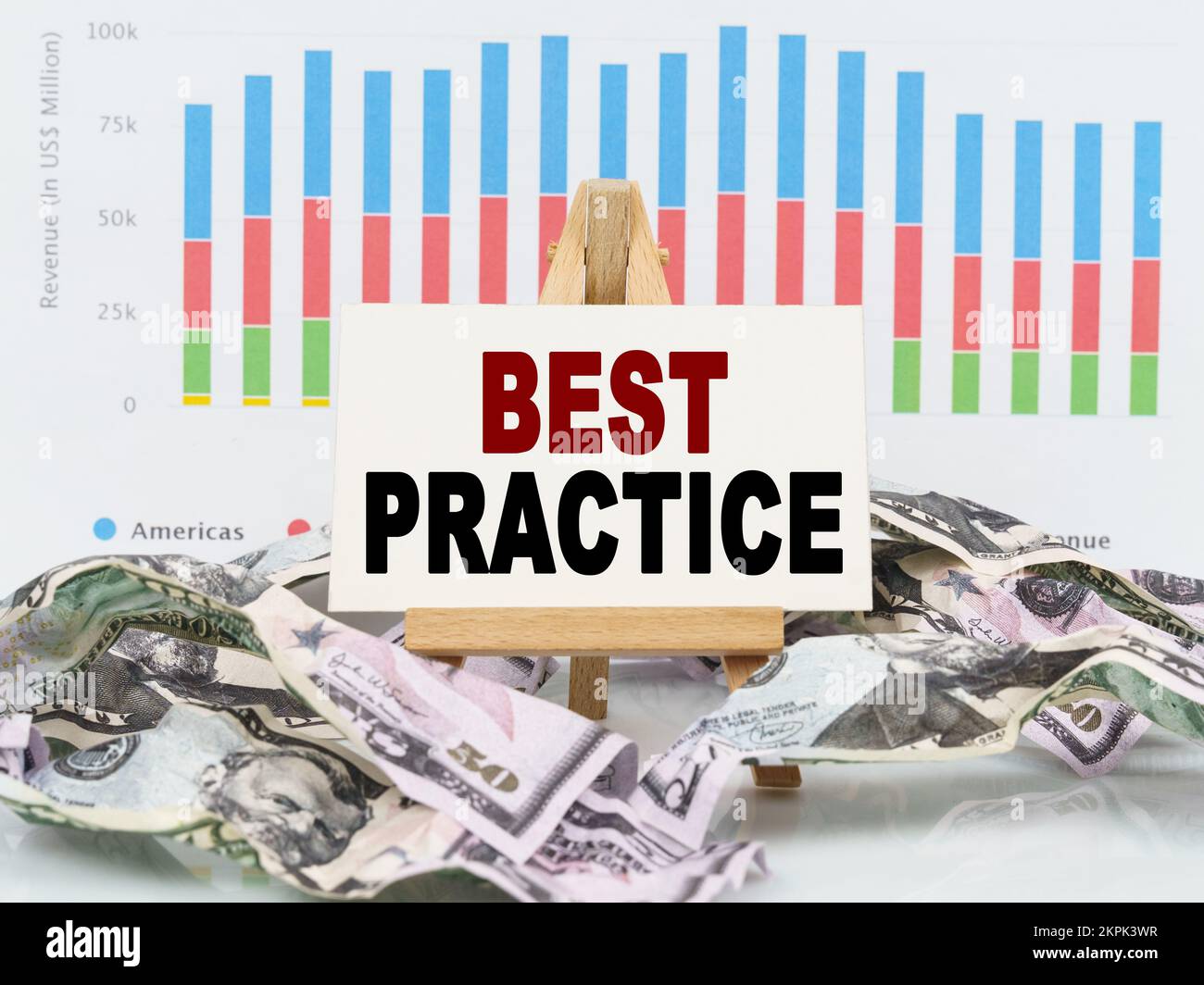 Business and finance concept. Among financial charts and money is a ...