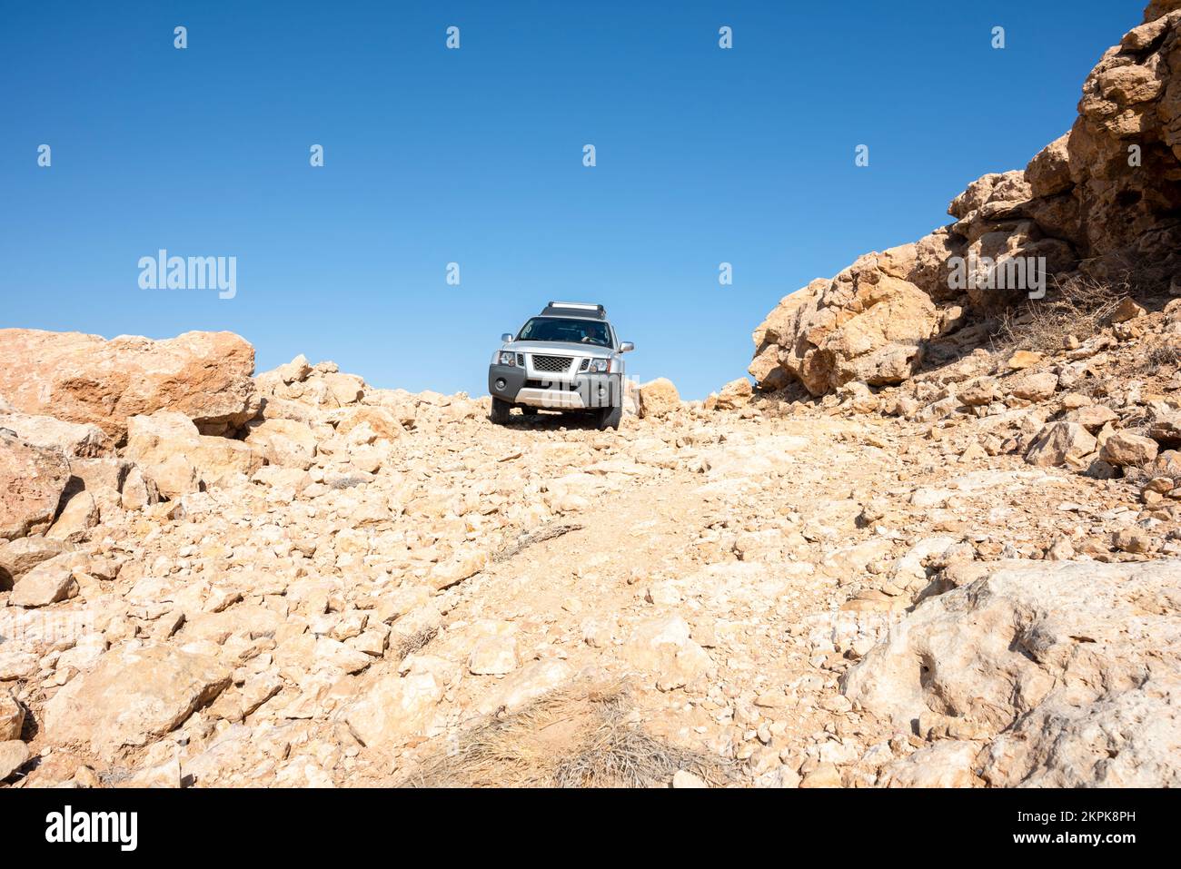 4wd vehicle descending an unpaved road in the mountains, extreme ...