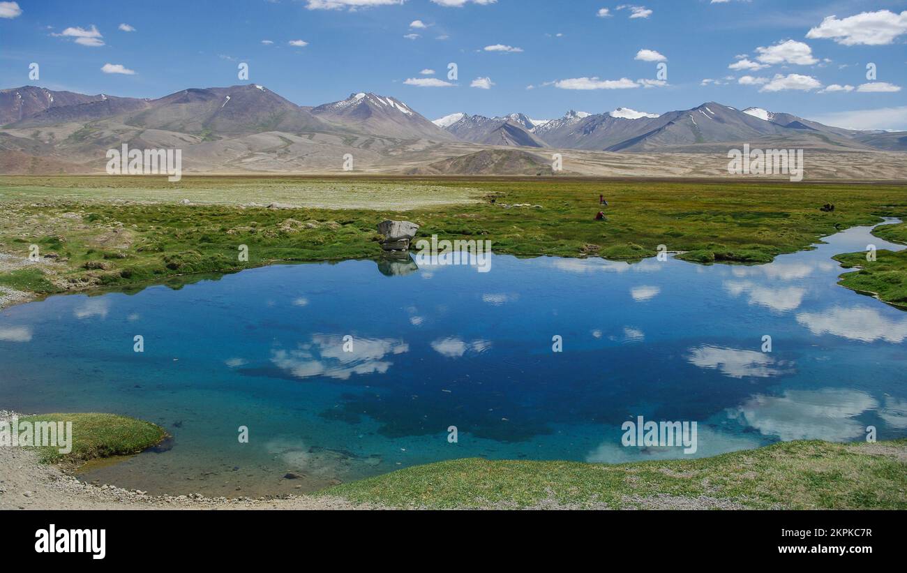 Landscape view of pure turquoise blue water of Ak Balik sacred spring ...