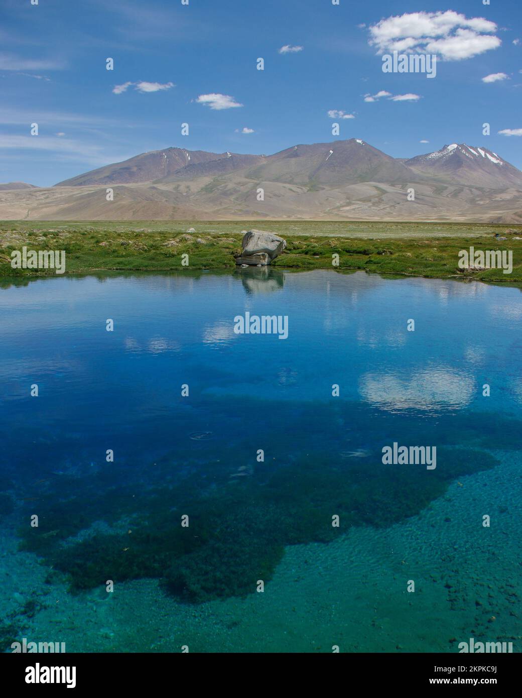 Colorful landscape view of pure turquoise blue water at Ak Balik sacred ...