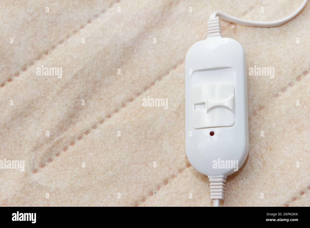 A warm two-sided new electric sheet, lies assembled, and on top of the ...