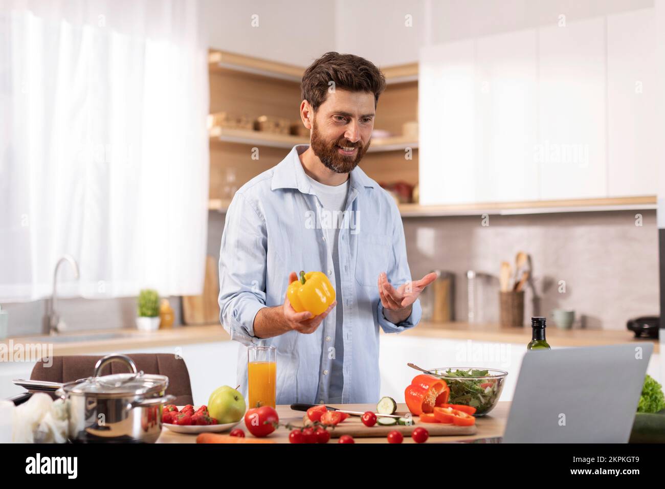 Glad mature caucasian guy with beard has video call, makes video at ...