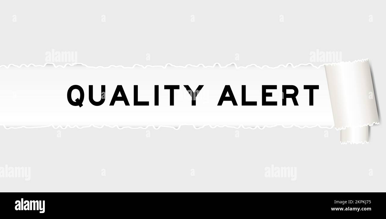 Ripped gray paper background that have word quality alert under torn ...