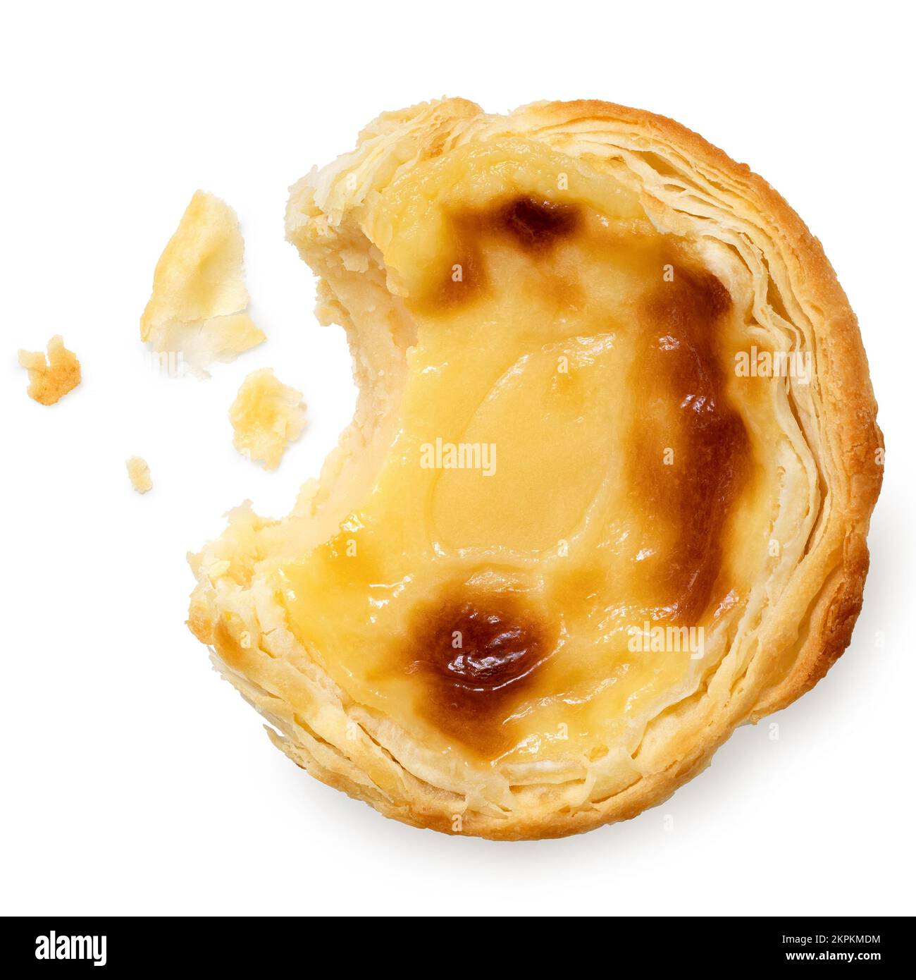 Partially eaten portuguese custard egg tart with crumbs isolated on ...