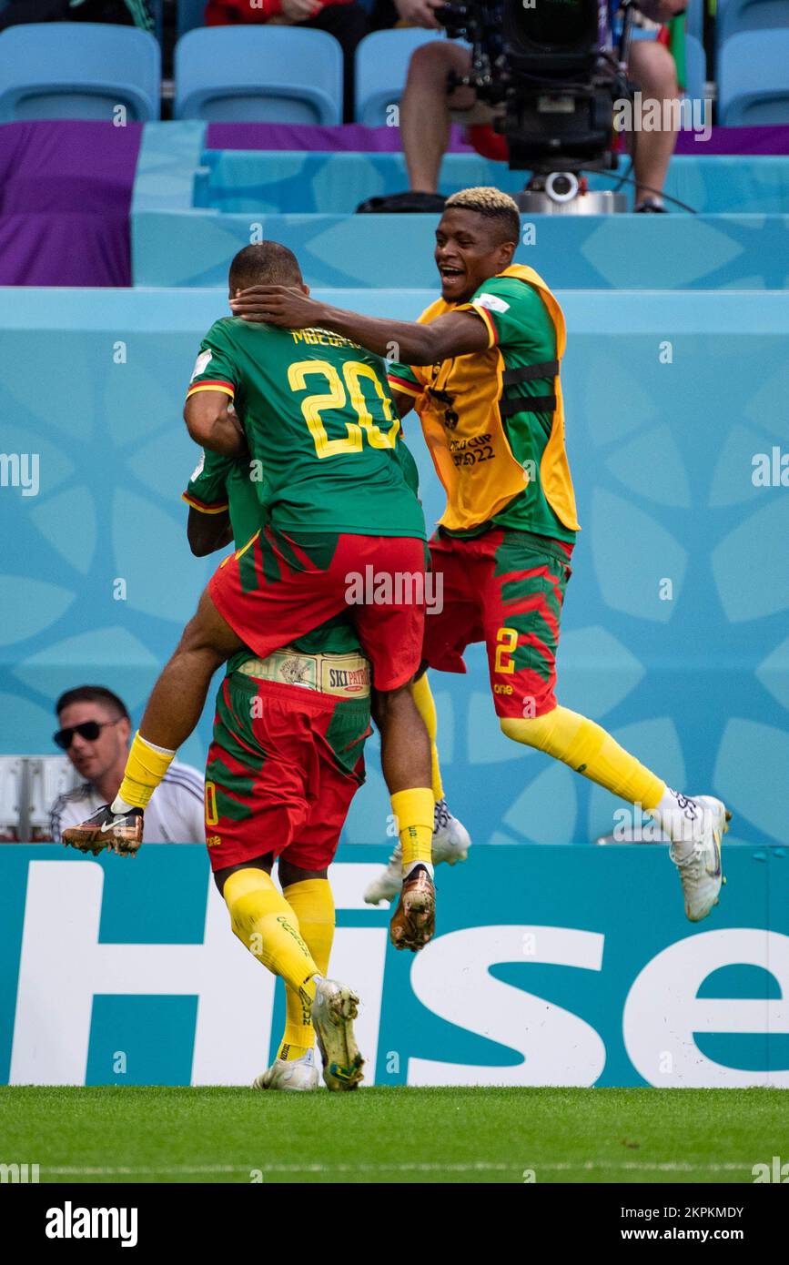 The Cameroonian players celebrate scoring with teammates during the ...