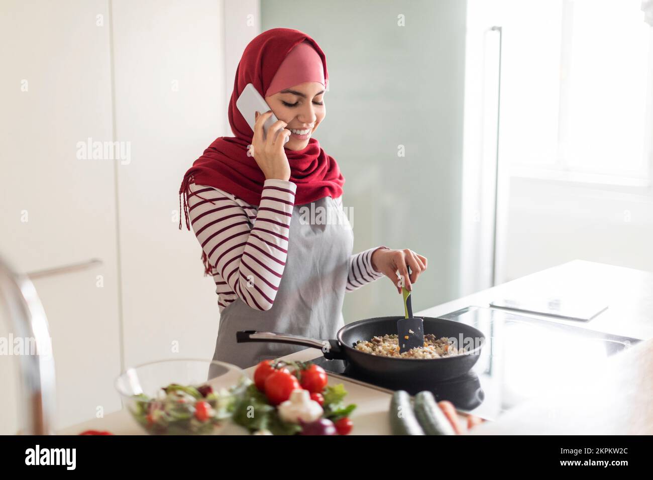 Smiling muslim woman talking hi-res stock photography and images - Alamy
