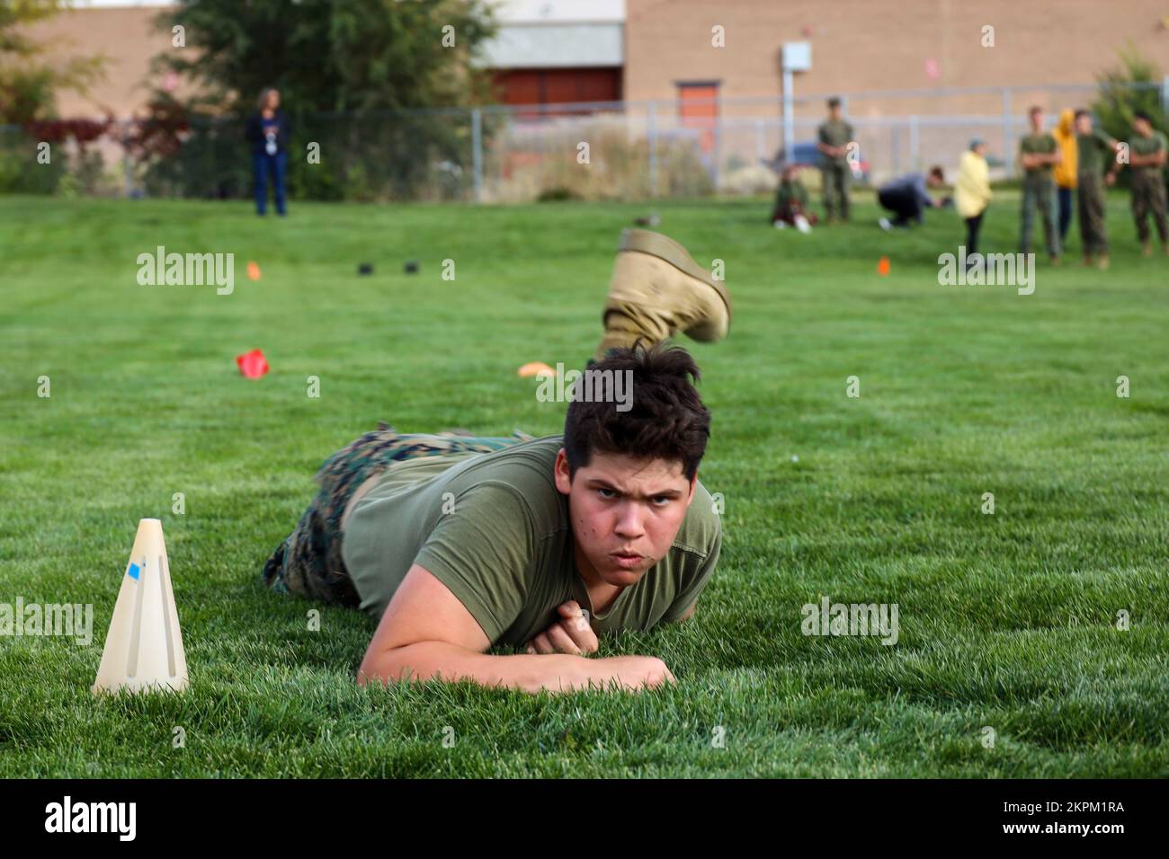 A student of El Dorado High School low-crawls while running a Combat ...