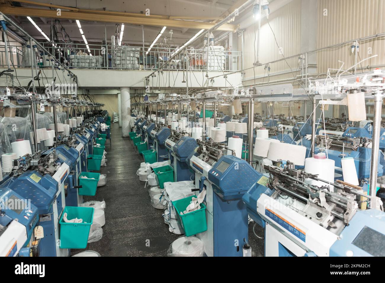 Interior of garment factory shop. Textile workshop with sewing machines, industry concept Stock ...