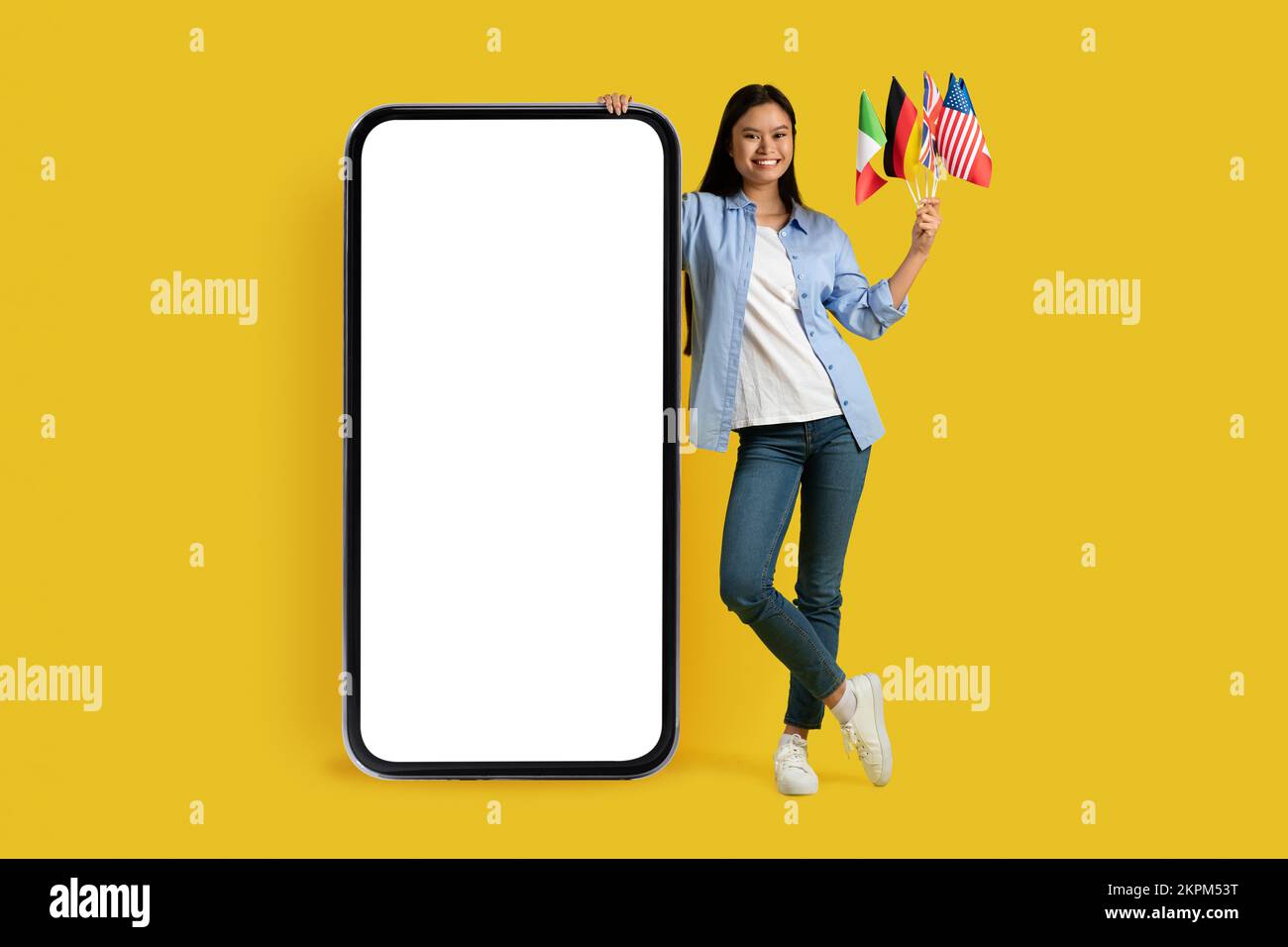 Happy young korean female student show many different flags with huge ...