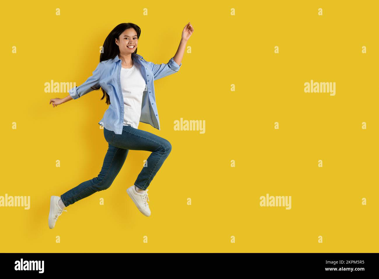 Satisfied excited cute young asian lady student in casual enjoy freedom ...