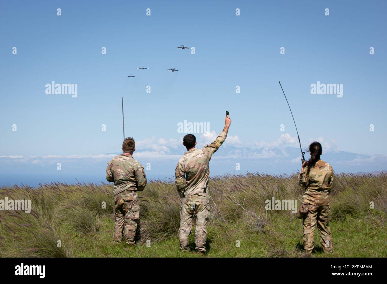 U.S. Army Soldiers, and a U.S. Air Force Airman, communicate to ...