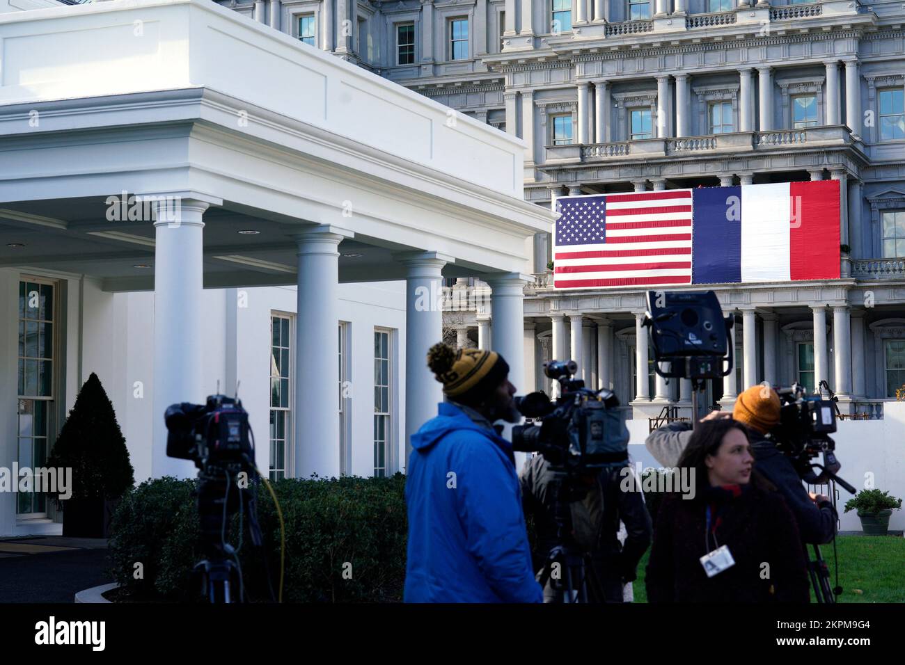 U.S. and French flags are installed on the Eisenhower Executive Office ...