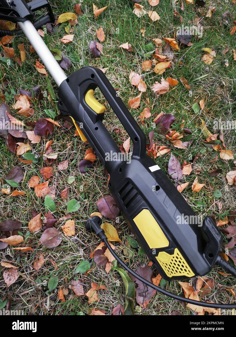 Household appliances: electric lawn mower-trimmer for mowing lawns . A ...