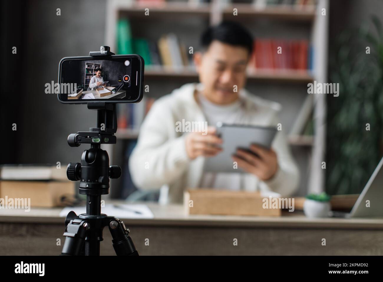 Focus on smart phone screen , man recording video on phone camera while ...