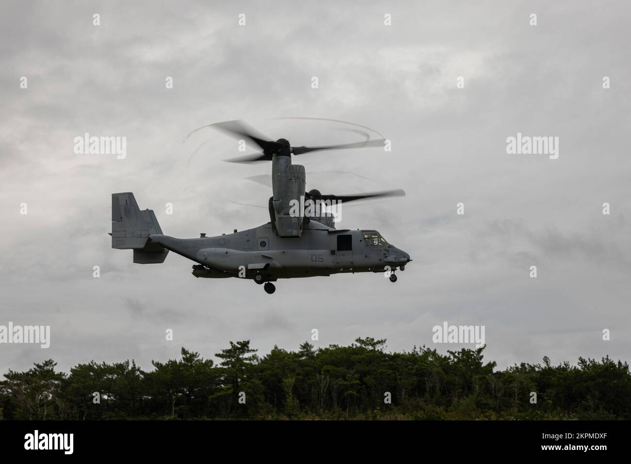 U.S. Marines with III Marine Expeditionary Force (MEF) fast rope from ...