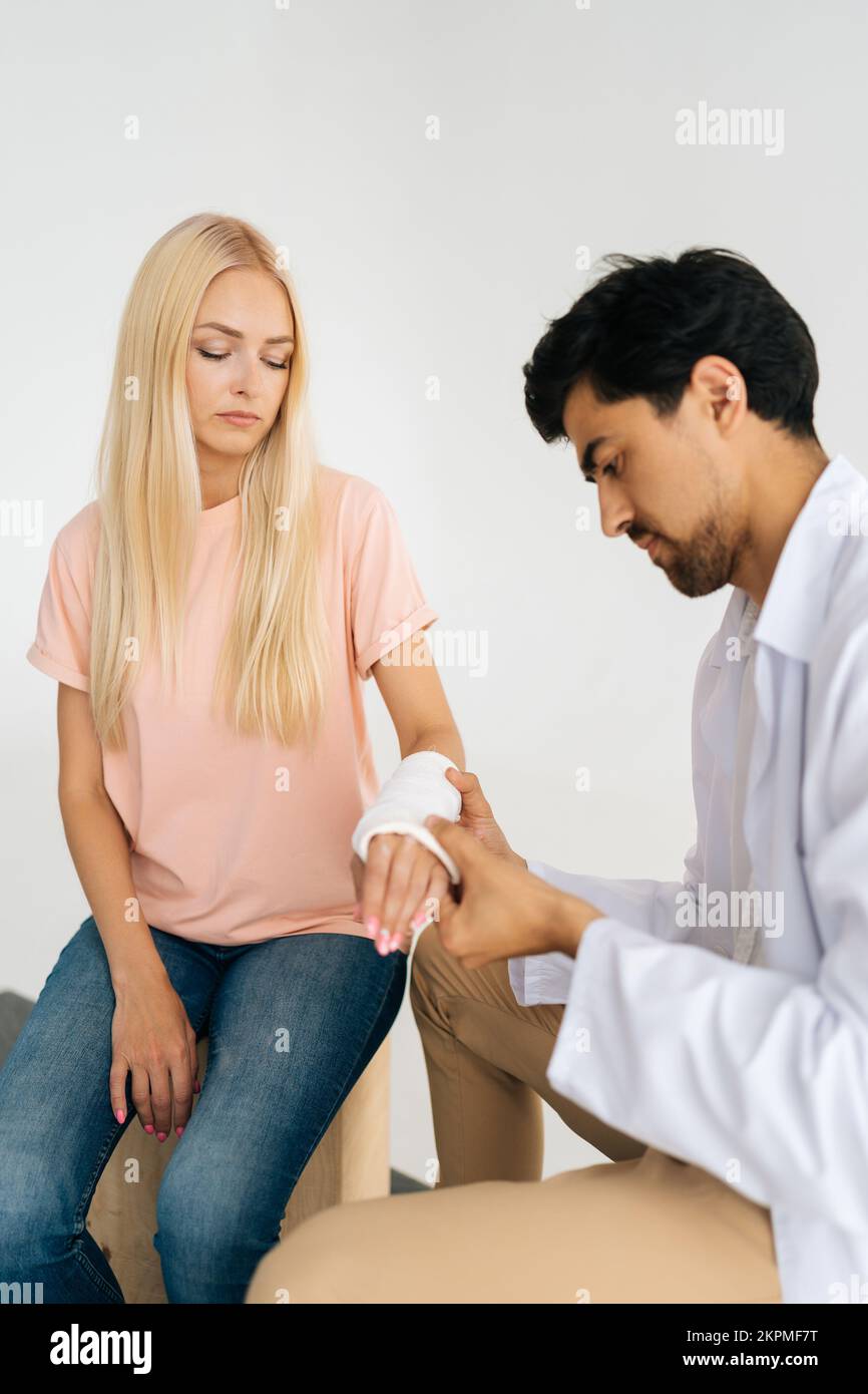 Vertical studio shot of male practitioner orthopedic in uniform ...
