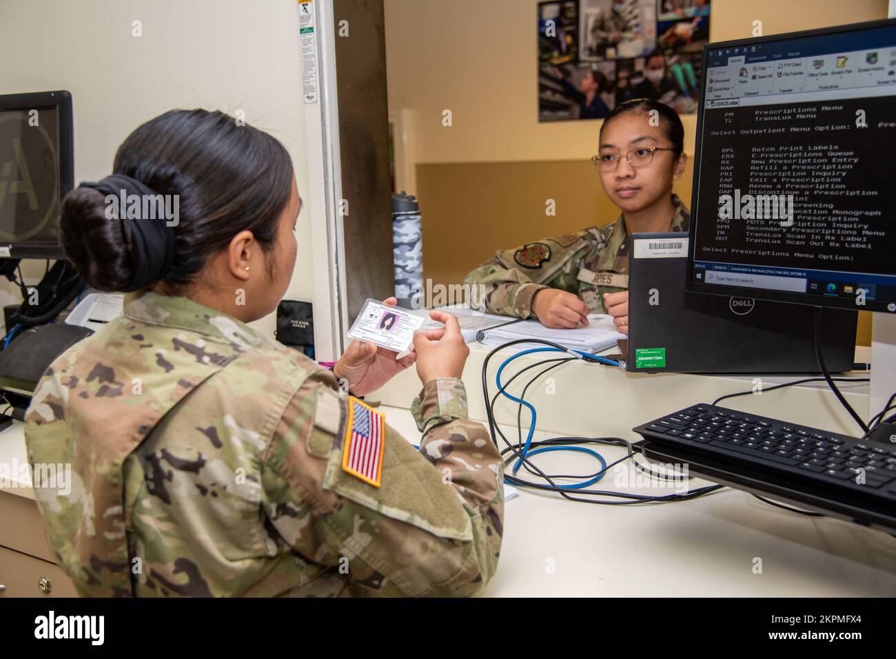 Students receive and review prescription orders during a pharmacy ...