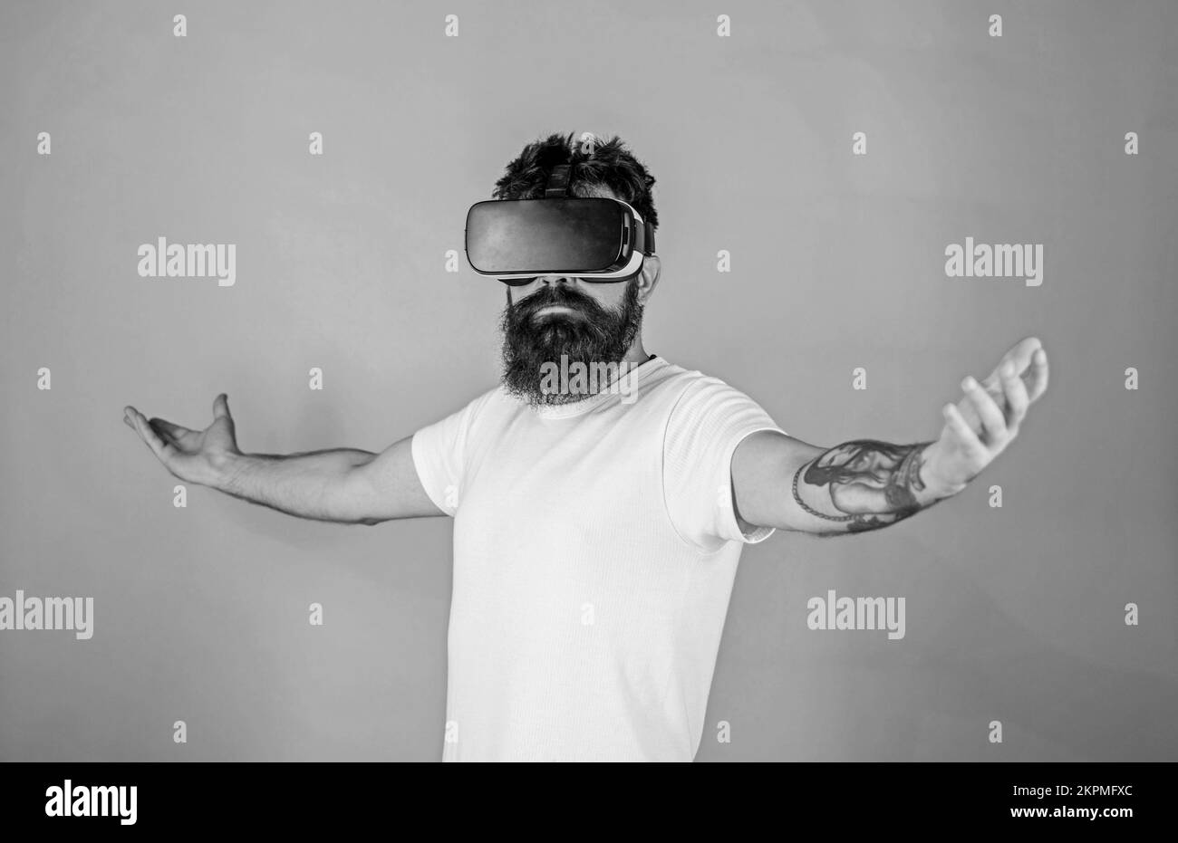 Superiority concept. Hipster on serious face raising hands while enjoy superiority in virtual ...