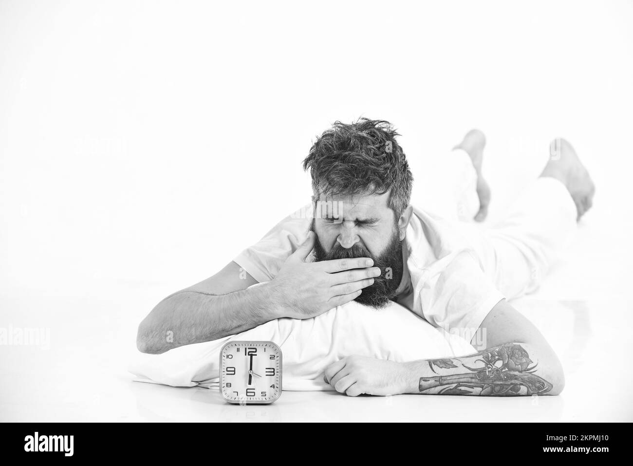 Man with tattoo sleep, morning, need to get up Stock Photo - Alamy