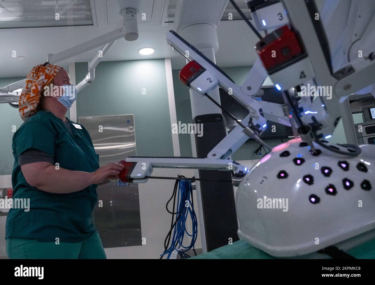 A medical staffer slides in a new tool sleeve into the 96th Medical ...