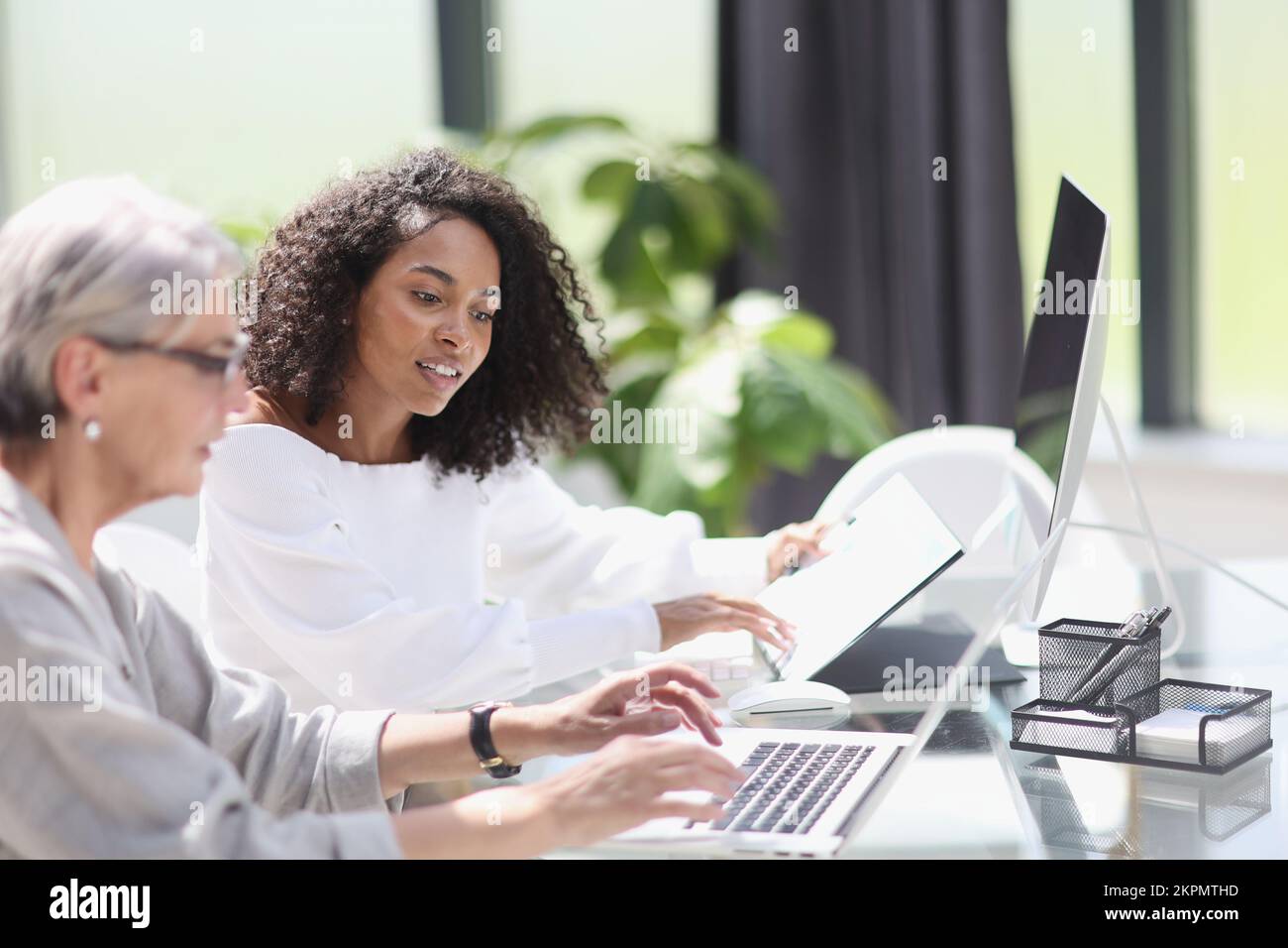 Software development team discussing algorithms on computer screen in office Stock Photo - Alamy