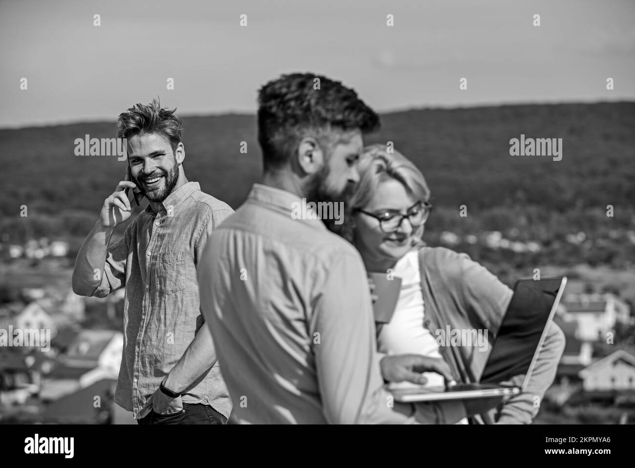 Colleagues with laptop work outdoor sunny day, nature background ...