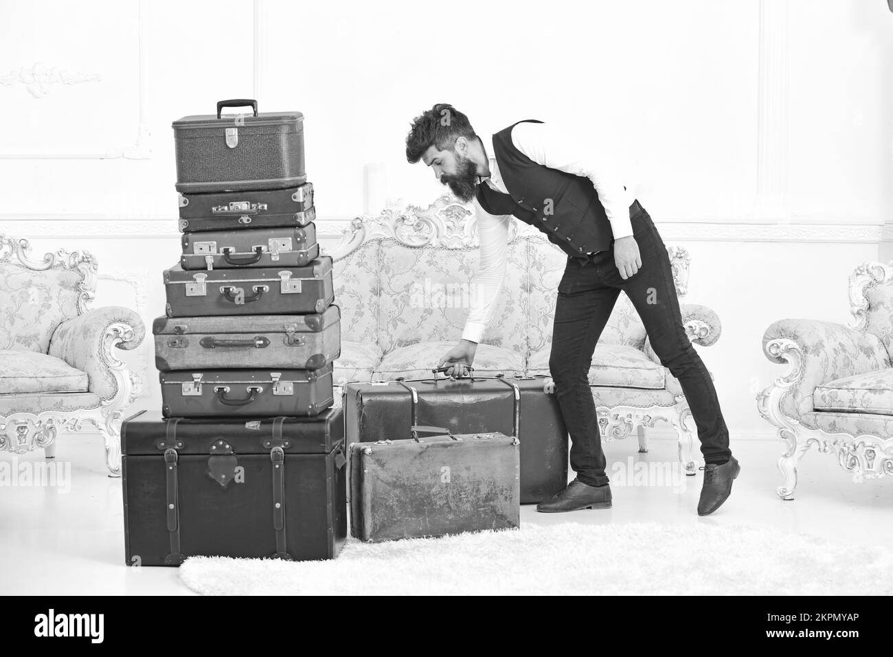 Macho elegant on strict face carries vintage suitcase. Man, butler with ...