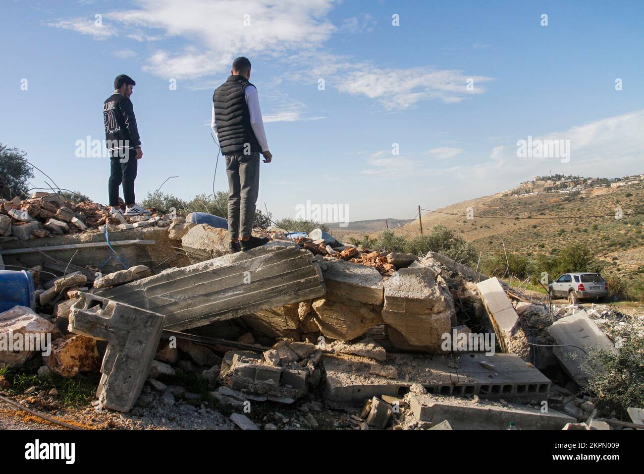Salfit, Palestine. 28th Nov, 2022. Palestinians inspect a destroyed ...