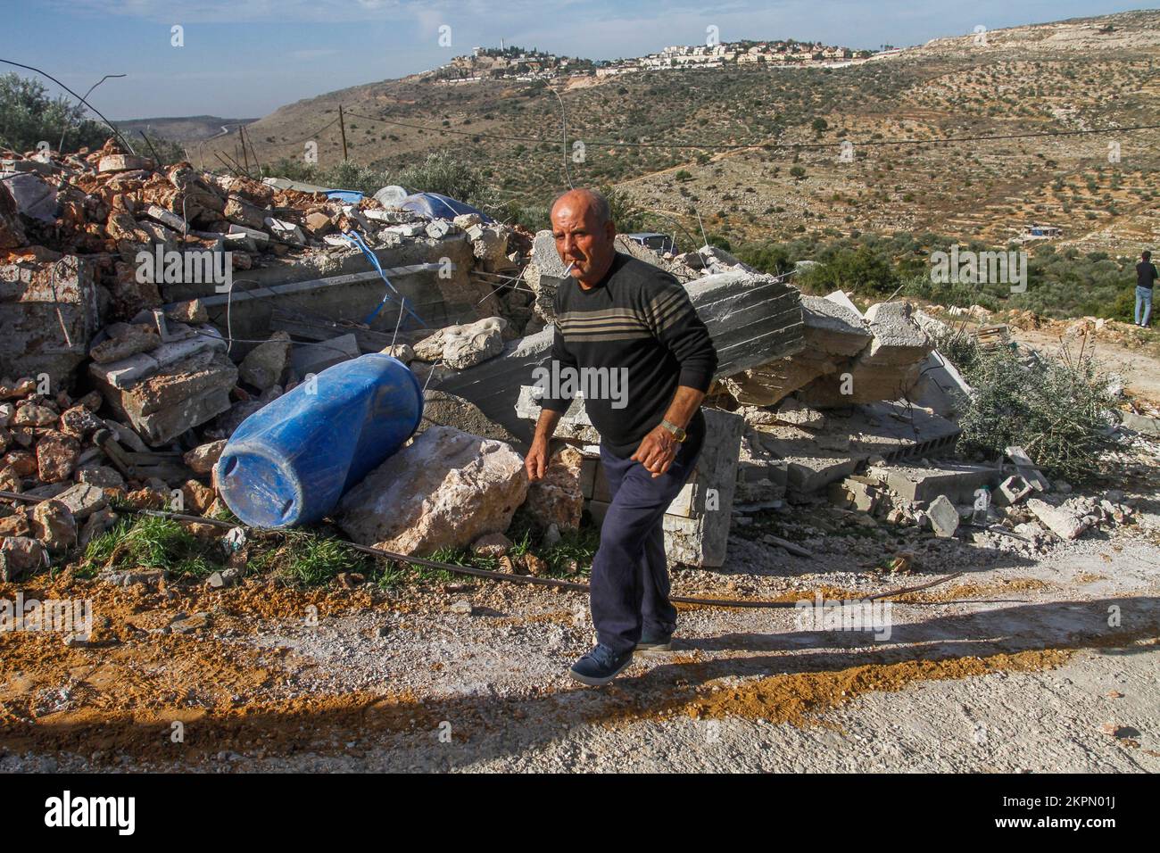 Salfit, Palestine. 28th Nov, 2022. Palestinian inspects a destroyed ...